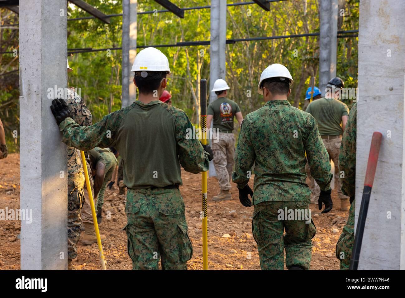 Members of the Singapore Army with the 30th Combat Engineer Brigade ...