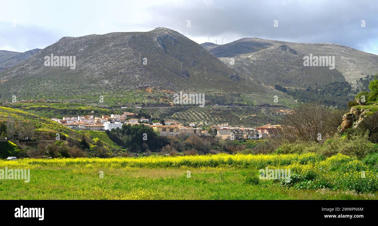 Small village in distance with mountains of Sierra de Loja behind, Loja ...