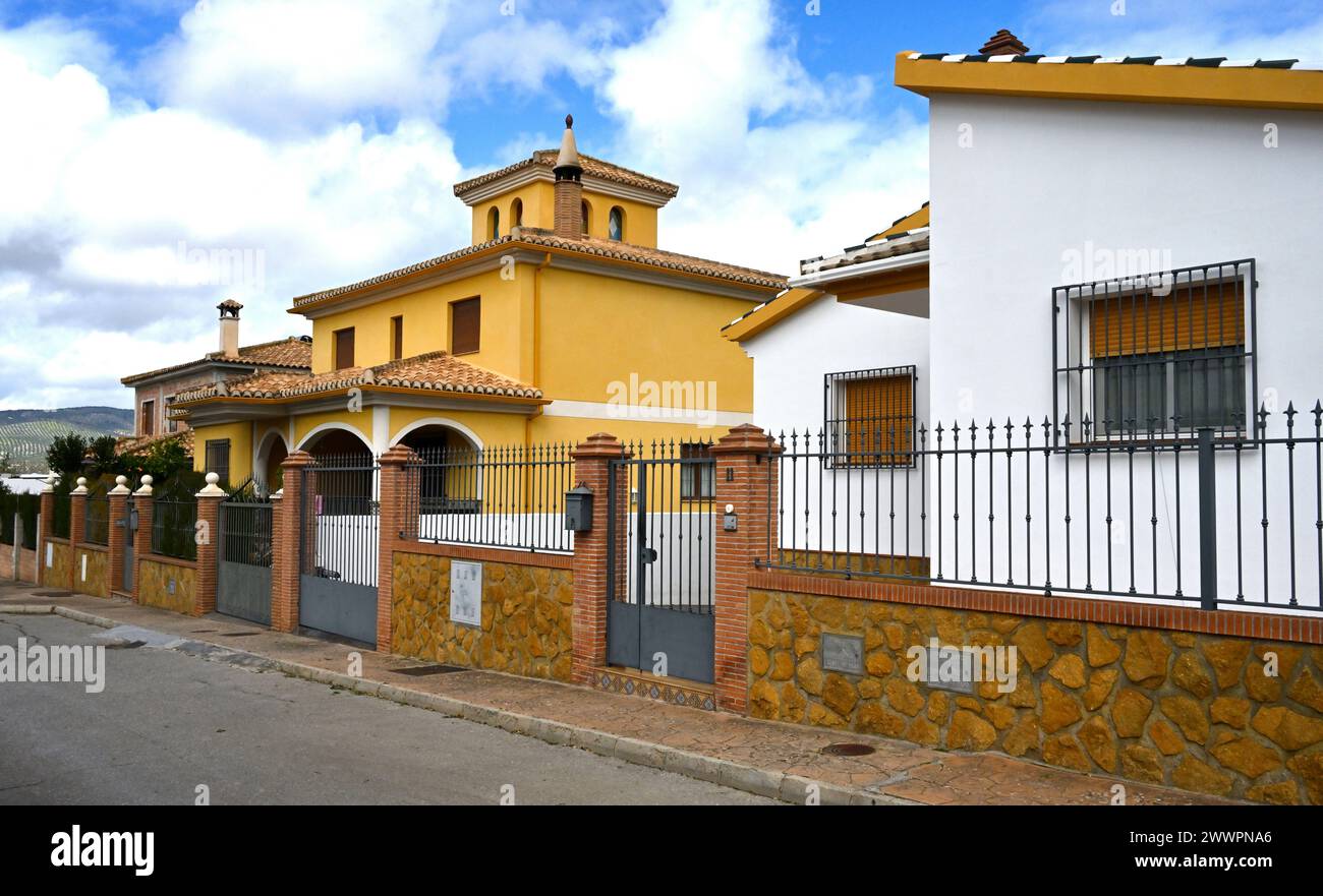 Street in Huétor Tájar, Granada, Spain with houses in local southern ...