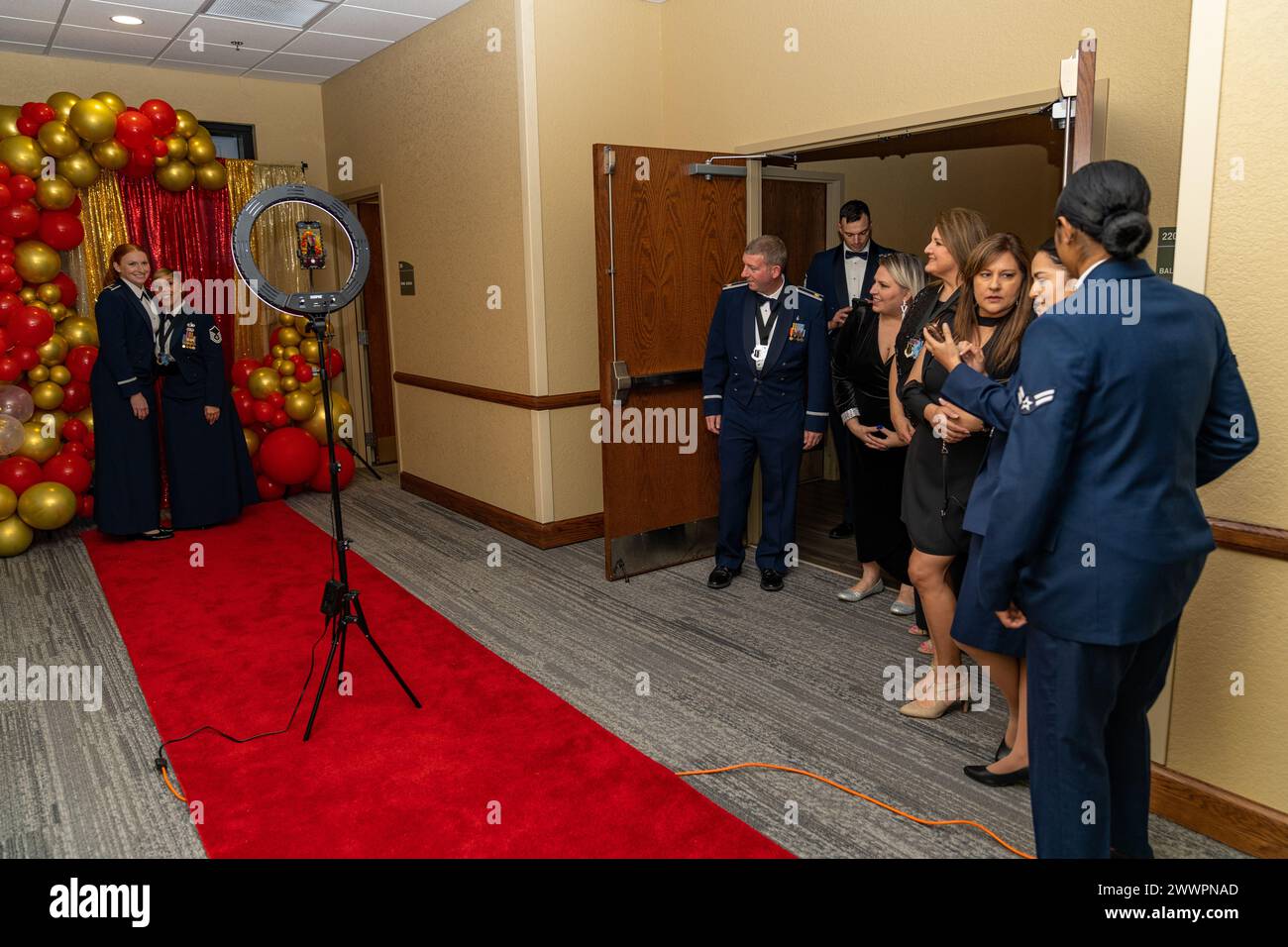 U.S. Airmen from the 81st Training Wing line up at the photo booth ...