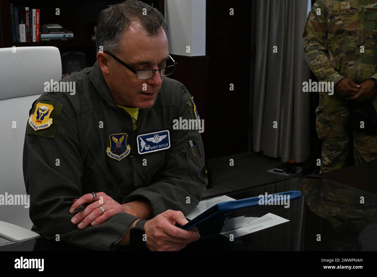 U.S. Air Force Col. Keith Butler, 509th Bomb Wing commander, reads the ...