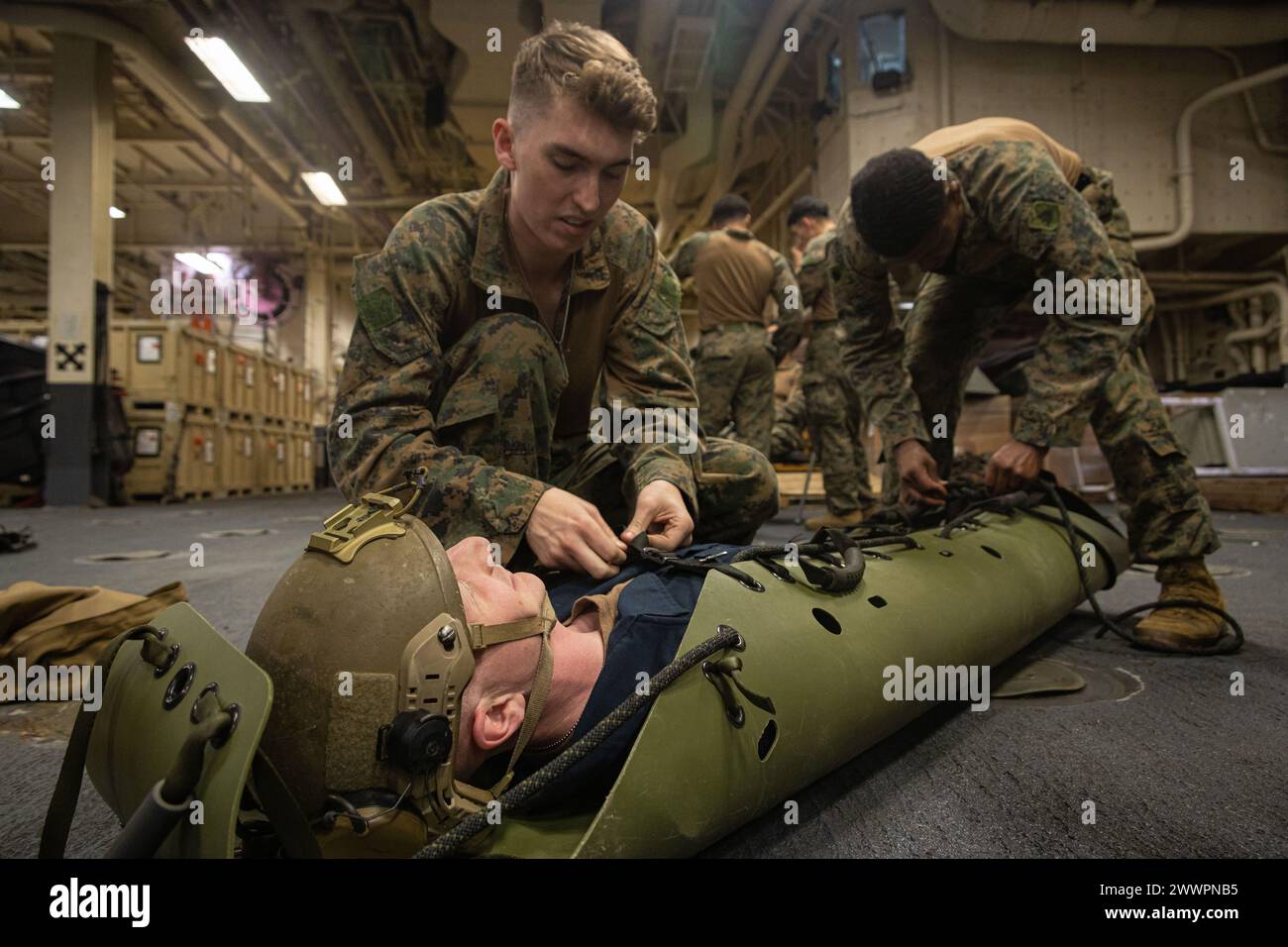 U.S. Marine Corps Cpl. Austin Holloway, center, and Sgt Malcolm ...
