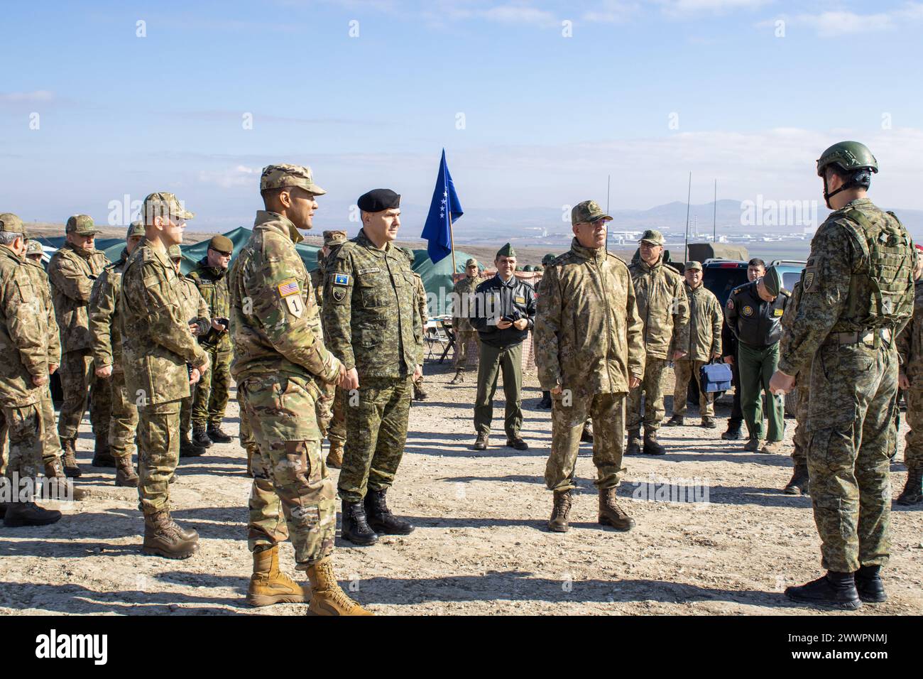 A Kosovo Security Force member, right, speaks to multinational high ...
