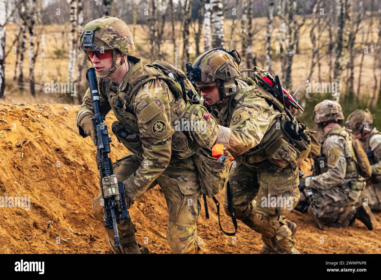 U.S. Army Spc. Eggins Oliver, left, attached to 3rd squadron, 2nd ...