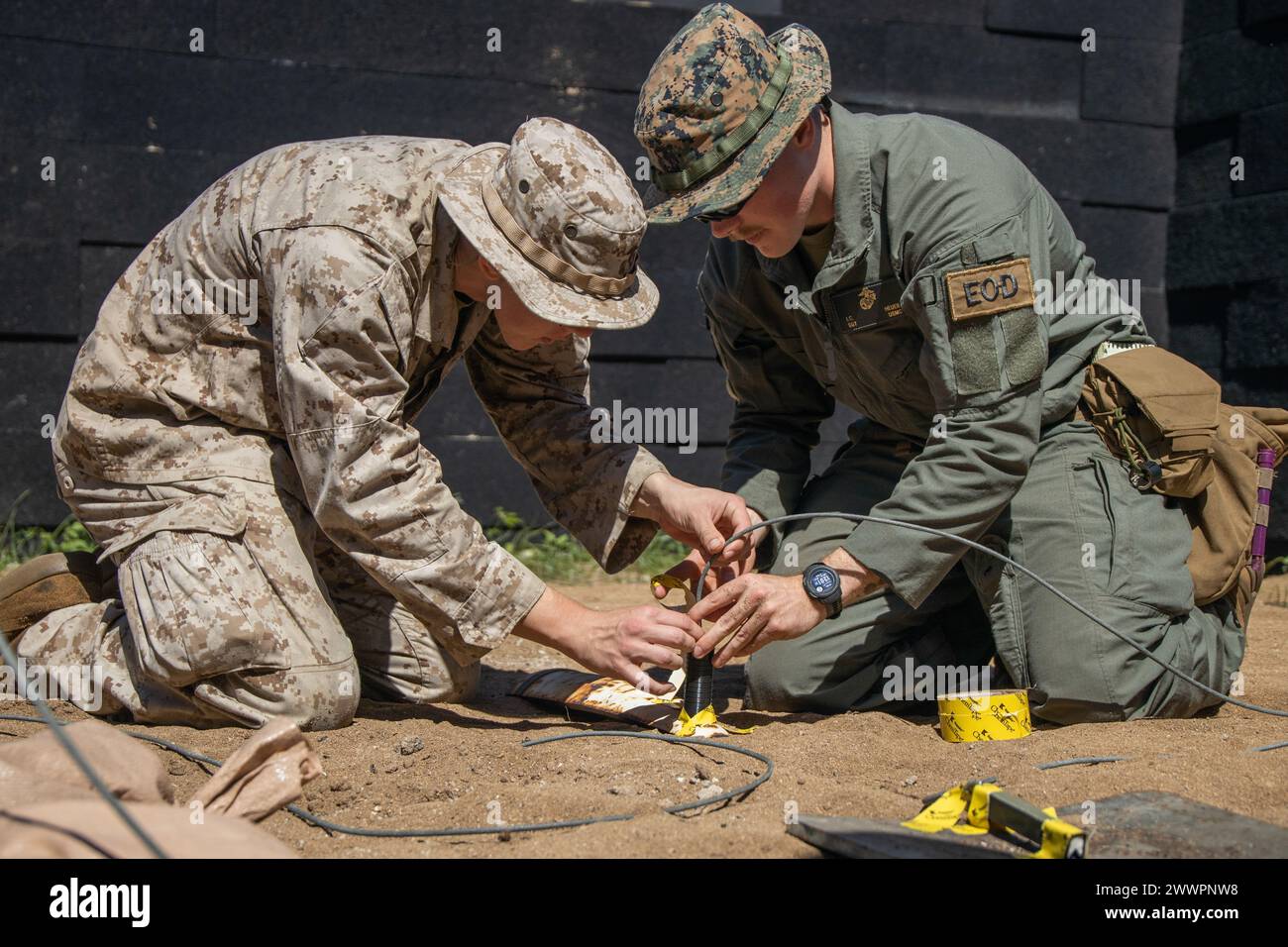 U.S. Marine Corps Sgt. Ian Heuer, right, an explosive ordnance disposal ...