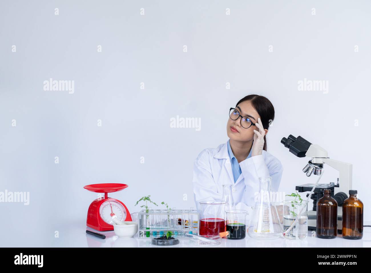 A female scientist demonstrating a pose while using her intellect Stock ...