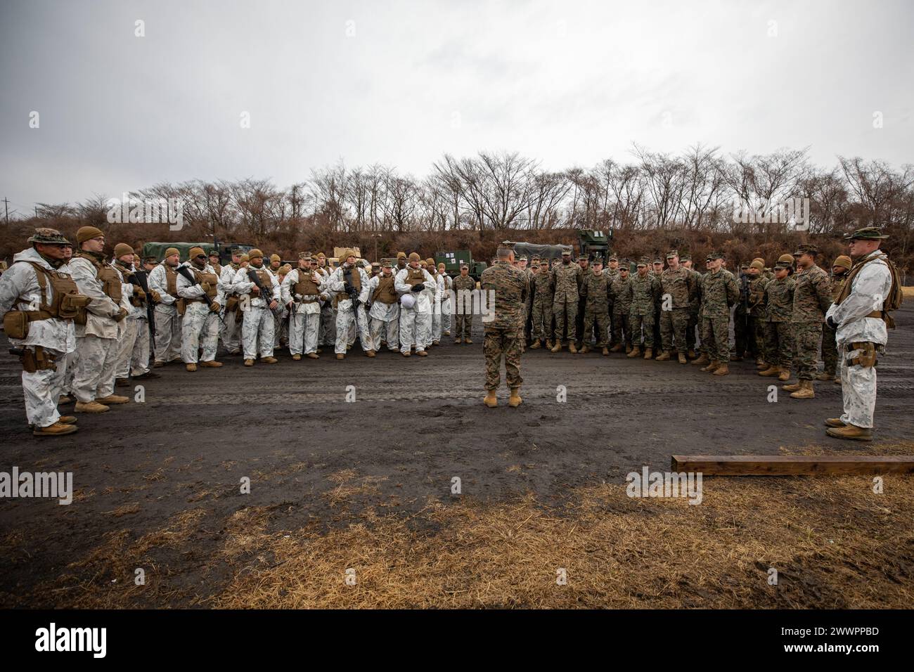 U.S. Marine Corps Brigadier General Adam Chalkley, center, the ...