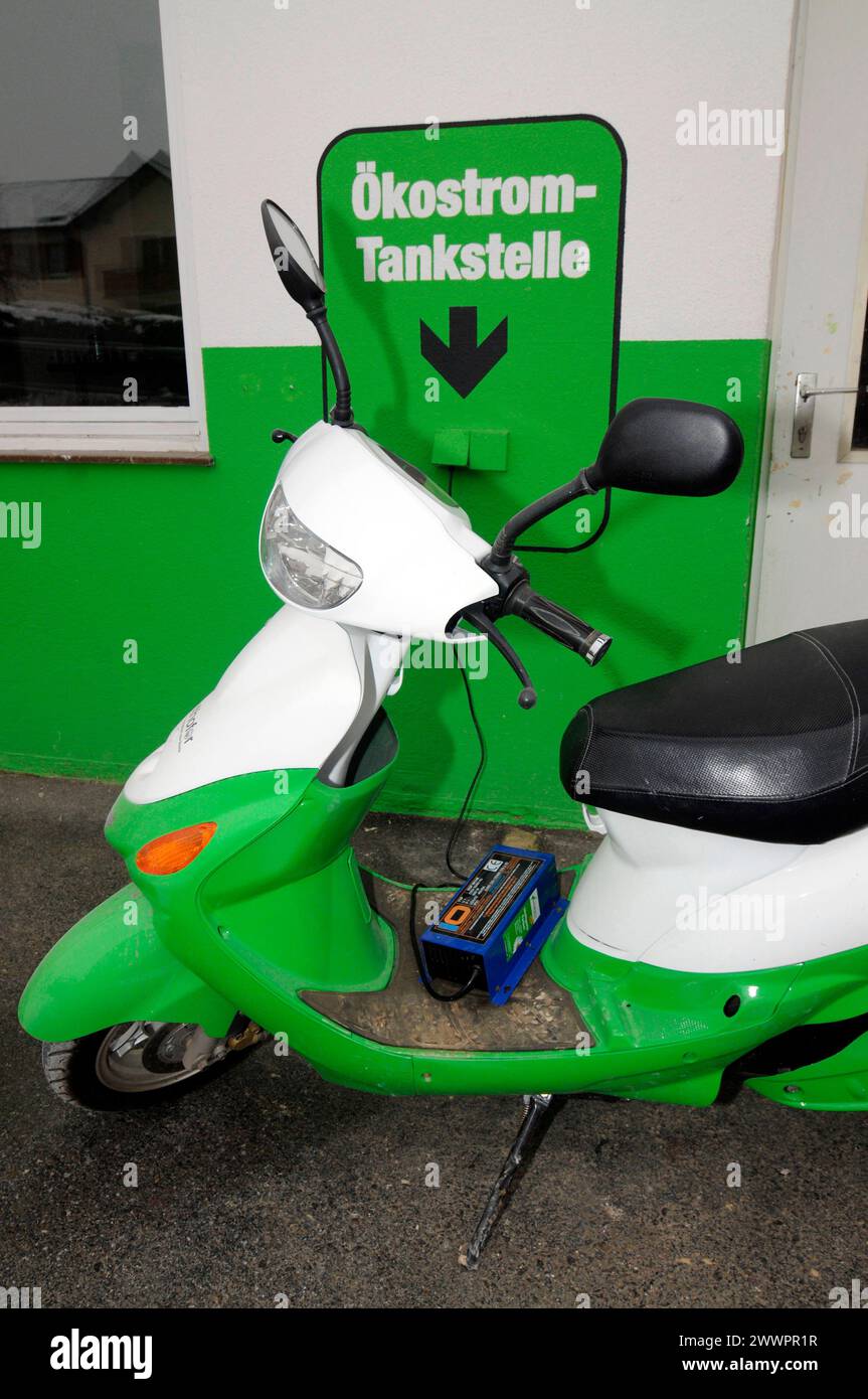 an e-bike charging at a charging station, electric vehicle and e ...