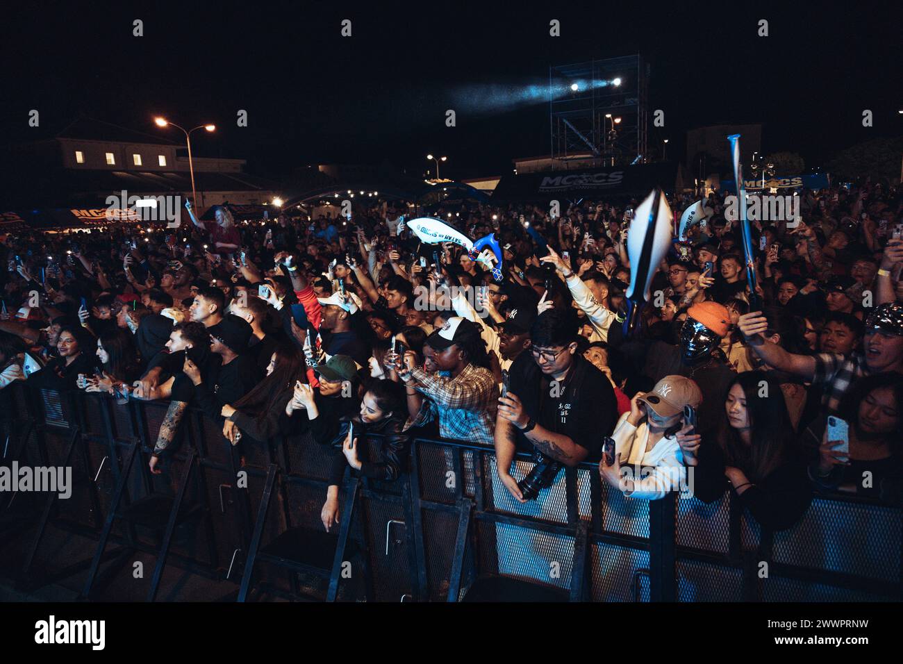 Attendees enjoy a performance by Kyle Harvey, a musical artist and ...