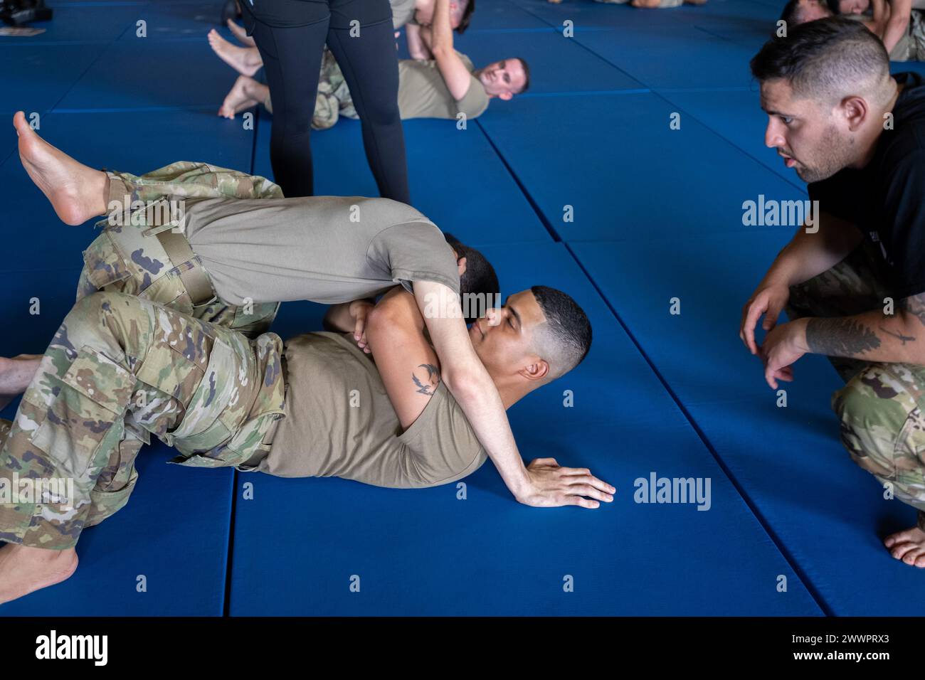 U.S. Air Force Staff Sgt. Carlos Santiago, right, a combatives ...