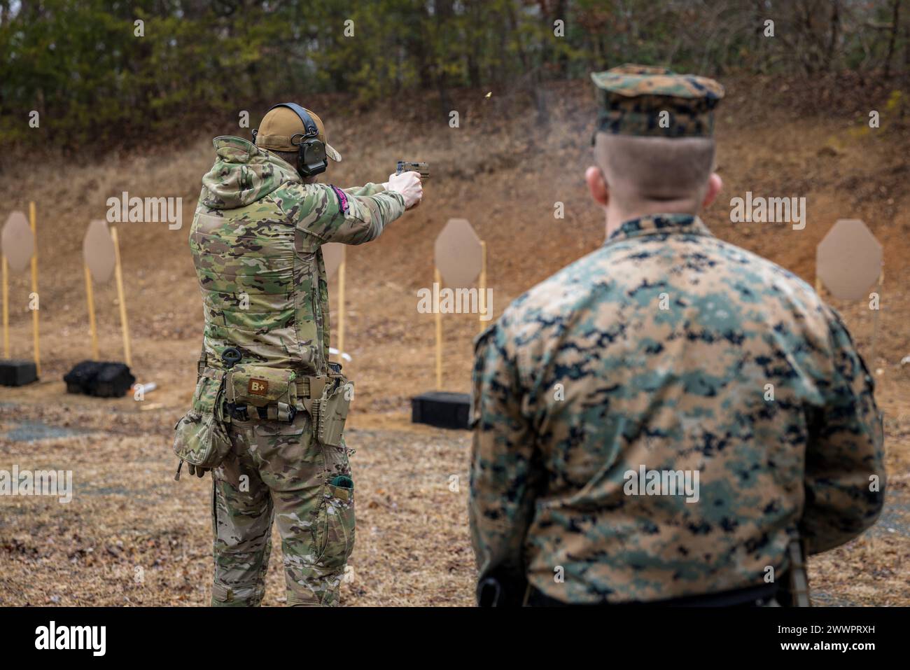 A British Royal Marine conducts shooting drills with the Marine Corps ...
