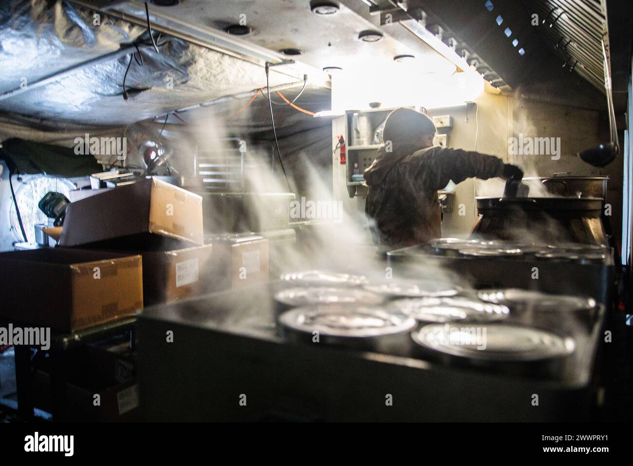 U.S. Army Spc. Katelyn D. Alvis, a culinary specialist assigned to ...