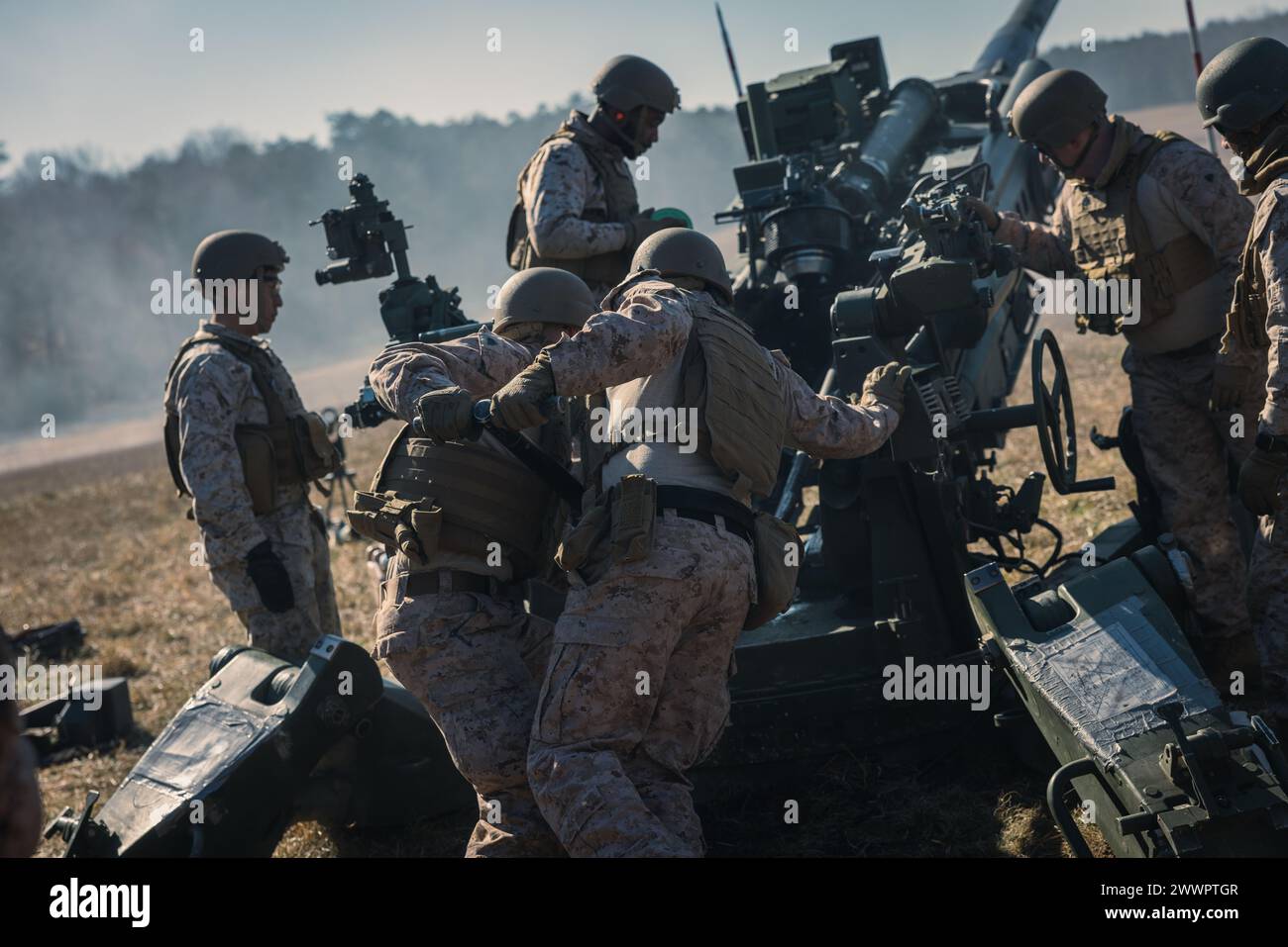 U.S. Marines with The Basic School demonstrate how to operate an M777 ...