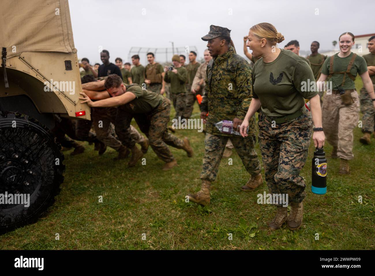 U.S. Marines with Marine Wing Support Squadron (MWSS) 172 push a Joint ...