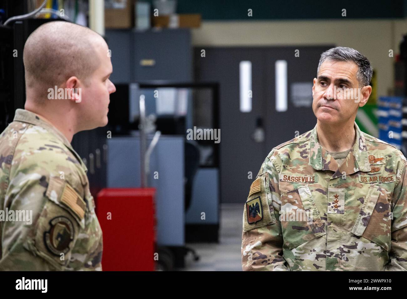 Lieutenant General Marc Sasseville listens as Tech. Sergeant Alex ...