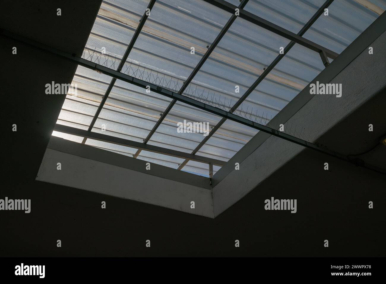 skylight, on a flat roof, and a structure that protects from rain but ...