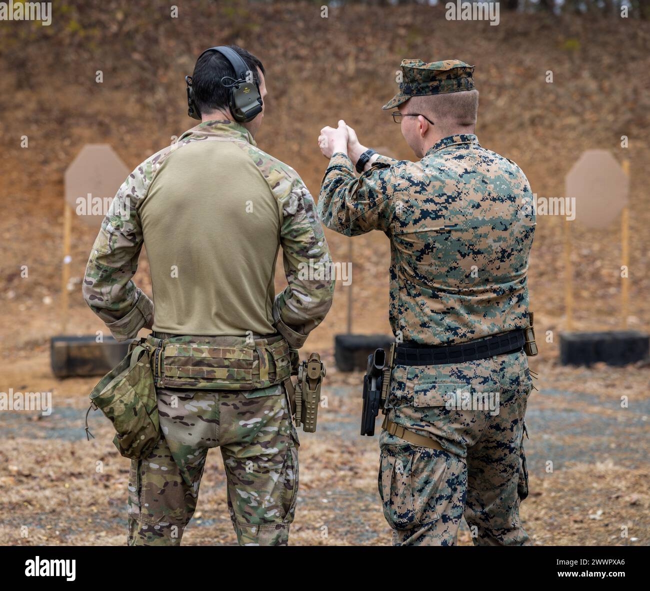 A British Royal Marine conducts shooting drills with the Marine Corps ...