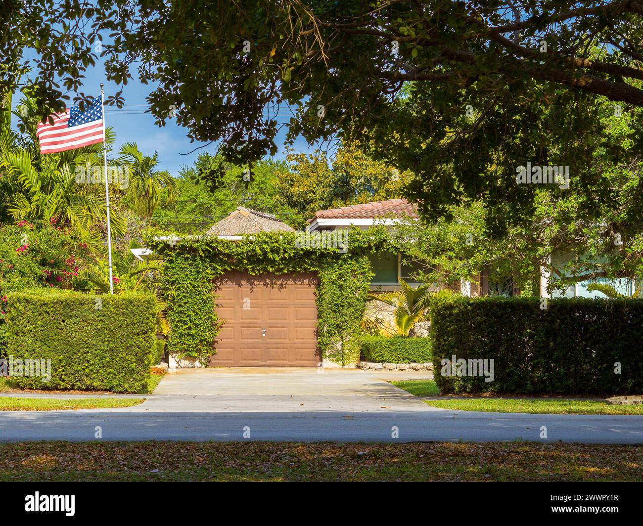 American flag front of house hi-res stock photography and images - Alamy