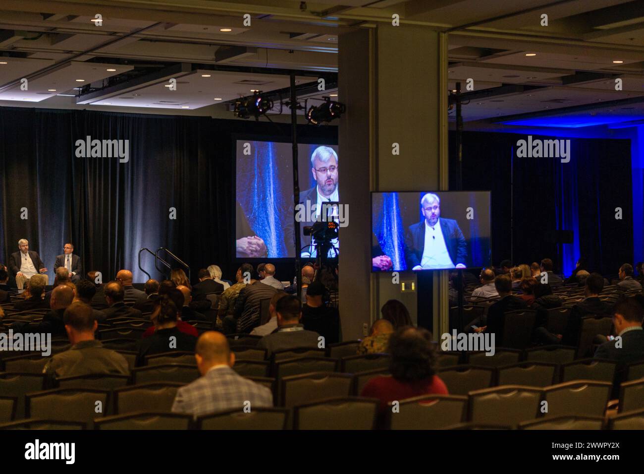 Main Stage Panelists on the Big Screen Stock Photo - Alamy
