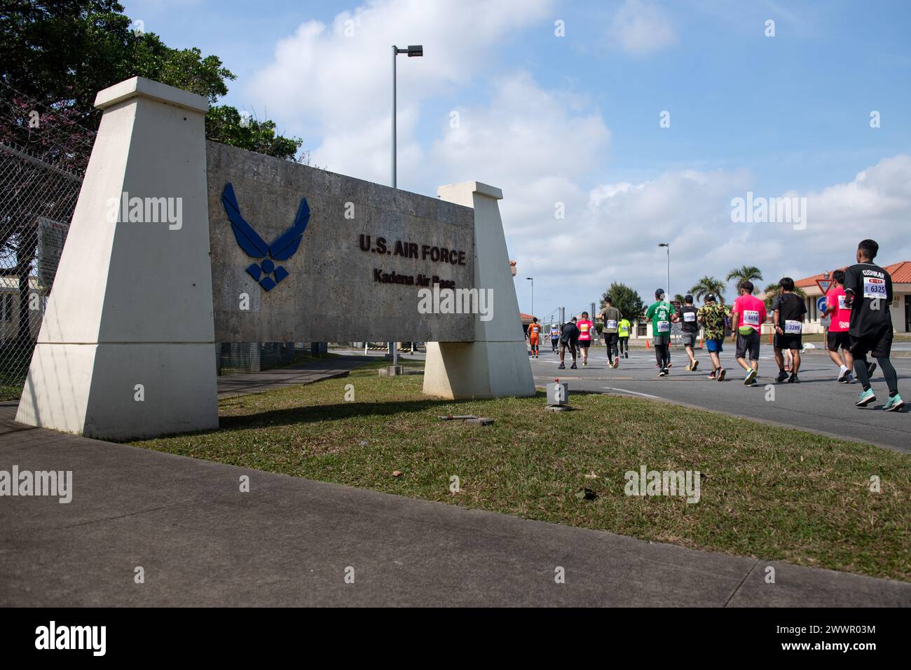 Runners enter gate 2 during the Okinawa Marathon at Kadena Air Base ...