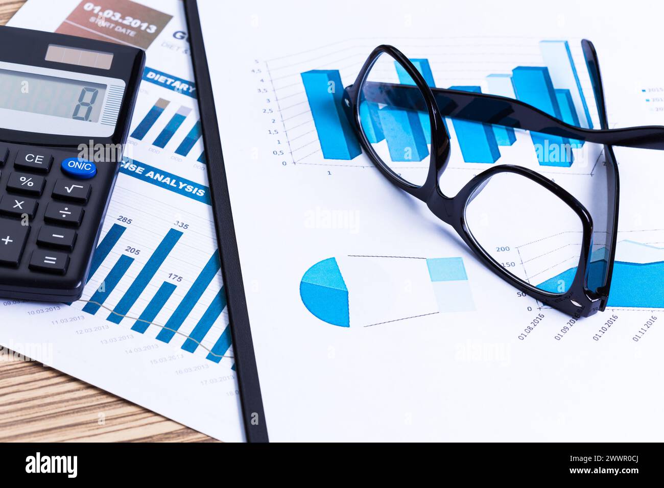 Graphs and Calculator Stock Photo - Alamy