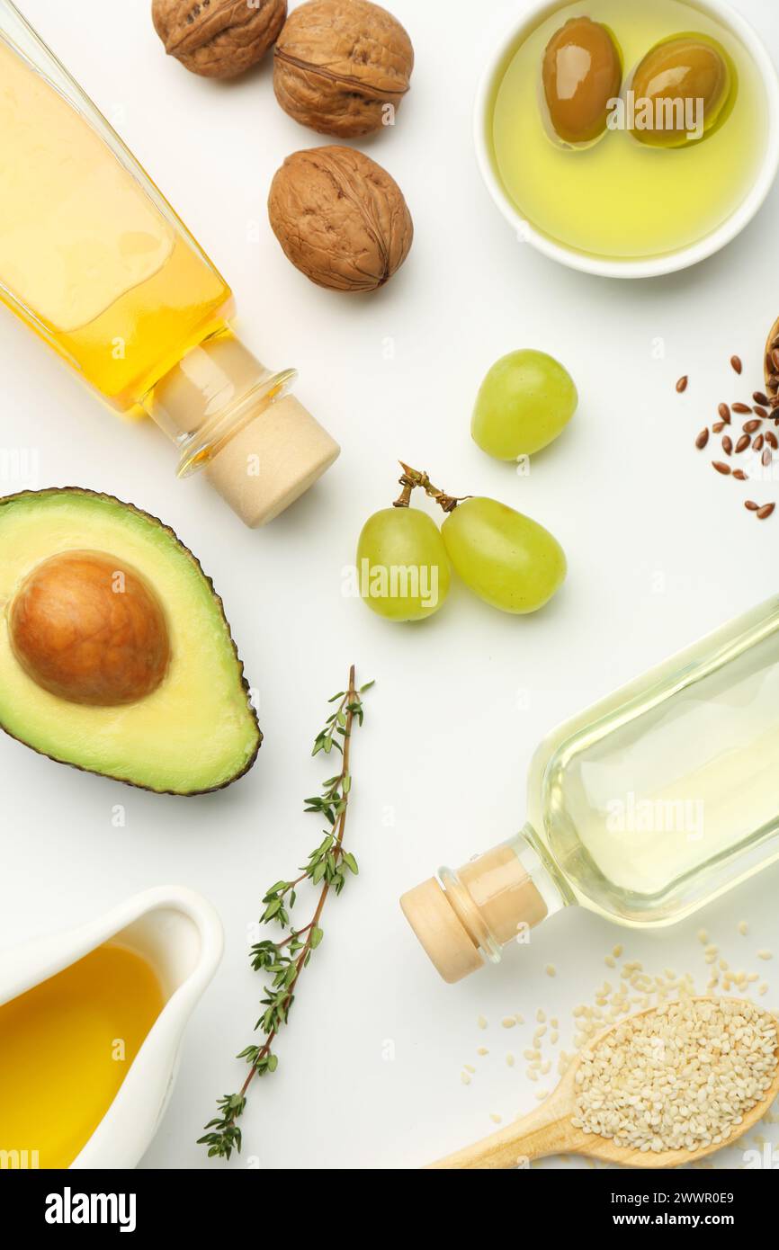 Vegetable fats. Different oils in glass bottles and ingredients on ...