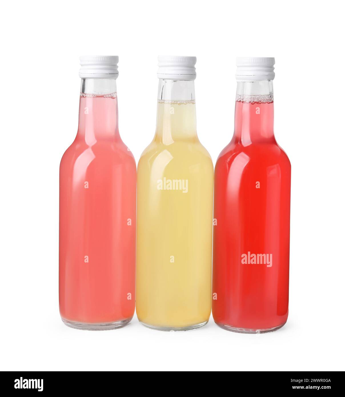 Delicious kombucha in glass bottles isolated on white Stock Photo - Alamy