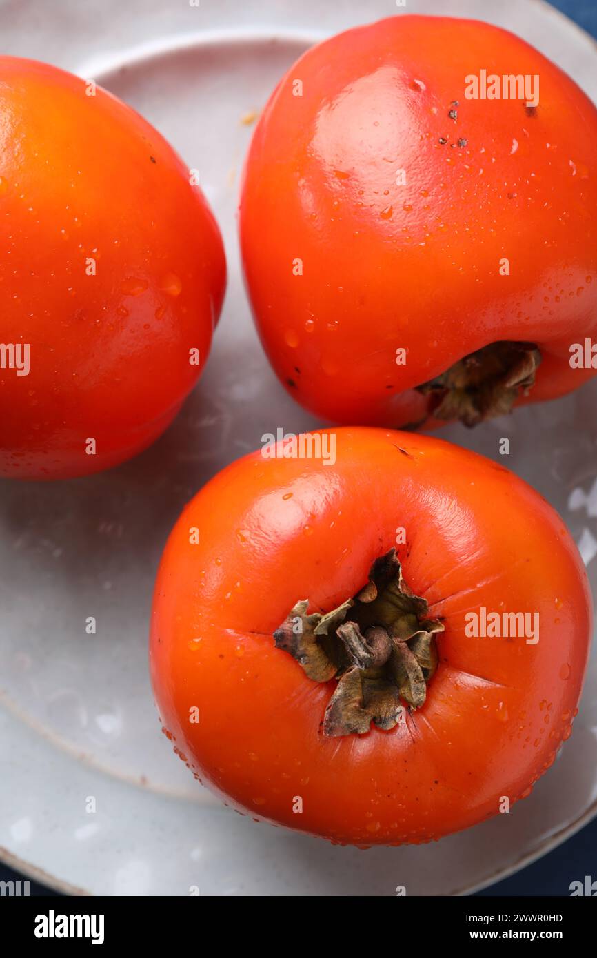 Plate sweet ripe persimmons hi-res stock photography and images - Alamy