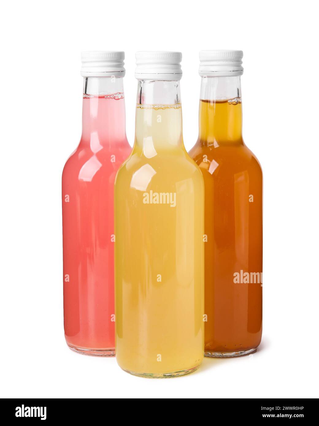 Delicious kombucha in glass bottles isolated on white Stock Photo - Alamy