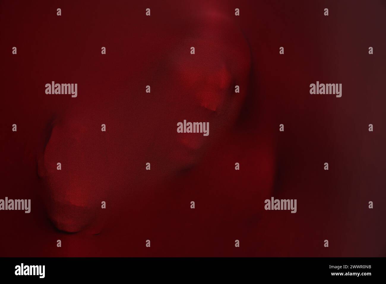 Silhouette of creepy ghost with skulls behind red cloth Stock Photo - Alamy