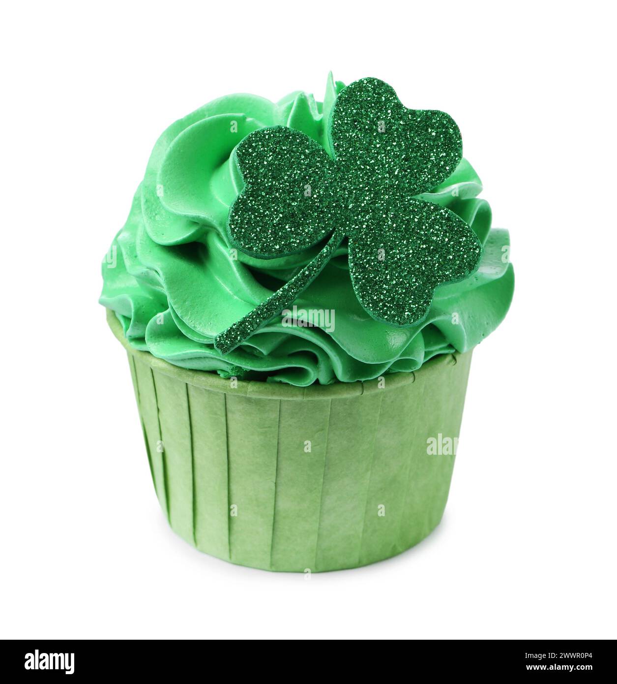 St. Patrick's day party. Tasty cupcake with green clover leaf topper ...