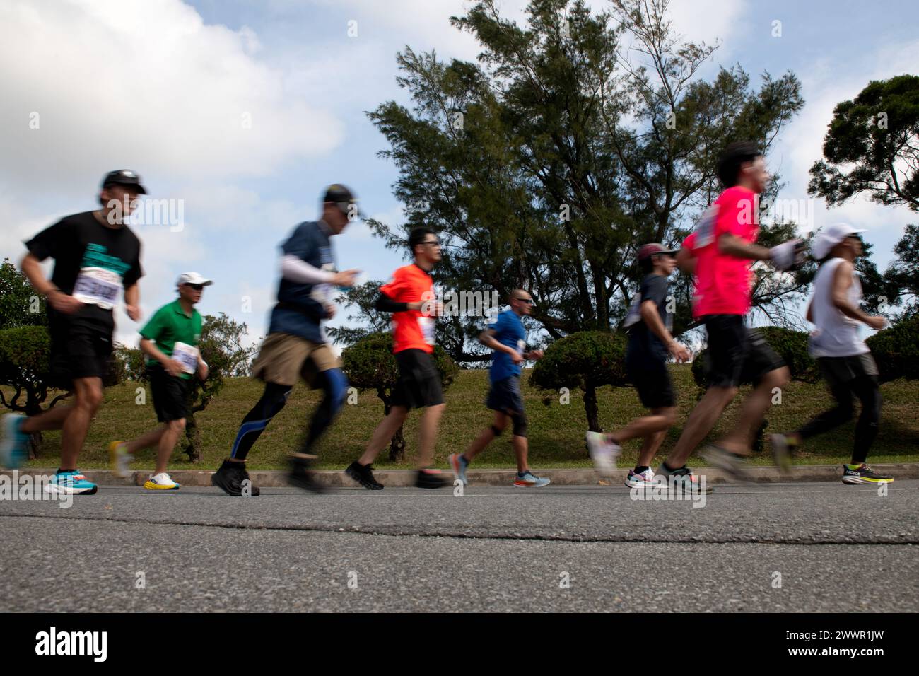 Runners participate in the Okinawa Marathon at Kadena Air Base, Japan ...