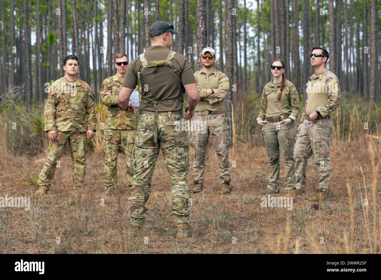 U.S. Air Force Air Commandos are being briefed prior to a survival ...