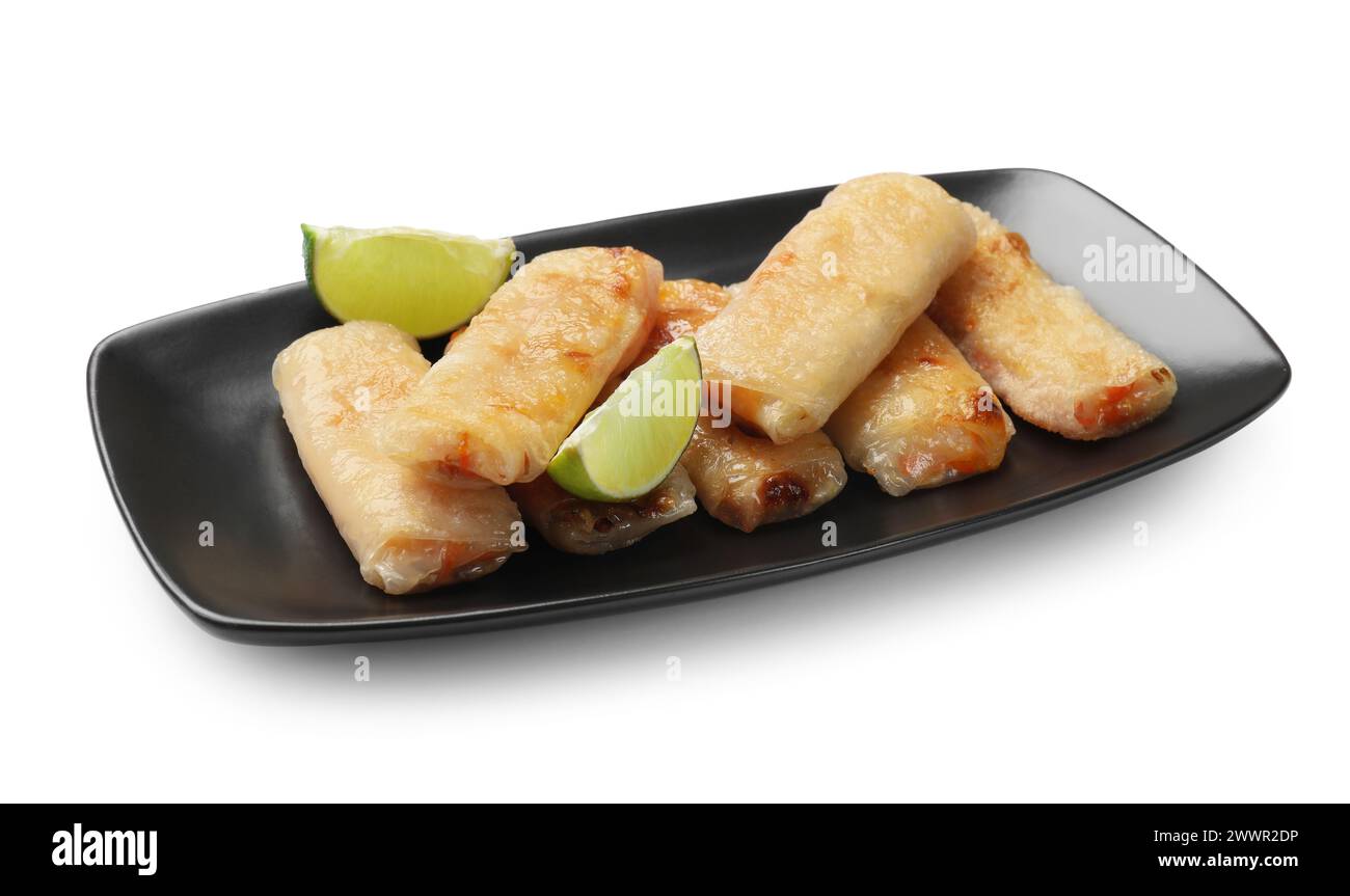 Tasty fried spring rolls and lime isolated on white Stock Photo - Alamy
