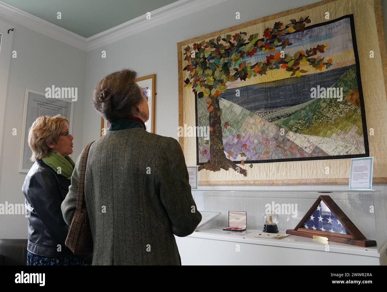 The Princess Royal views a memorial tapestry before laying a wreath at ...