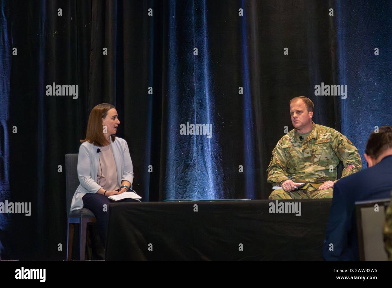 CDAO's Jennifer Hay moderates a breakout session, shown beside panel ...