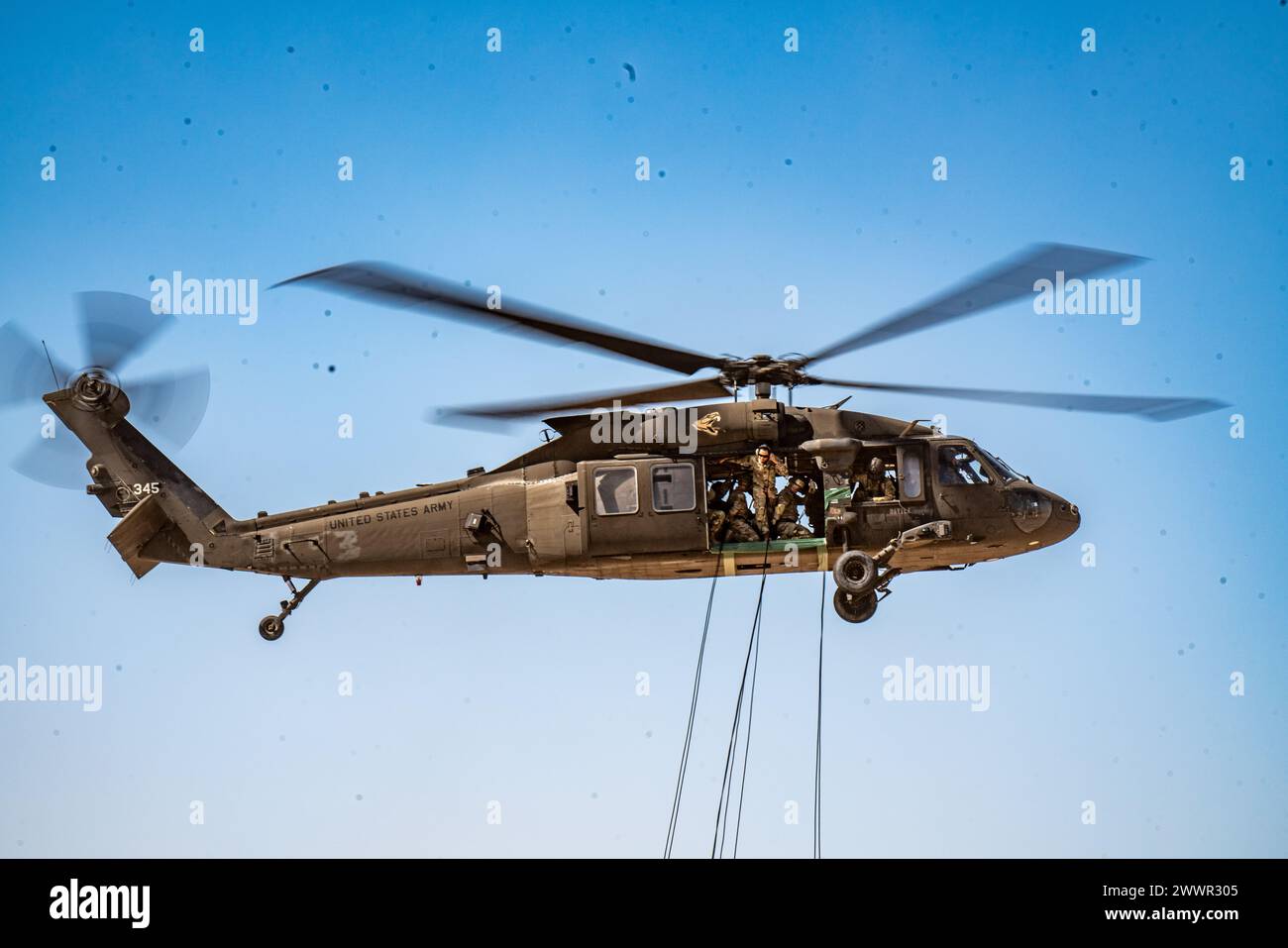 Air Assault candidates rappel out of a UH-60, February 22, 2024. After ...
