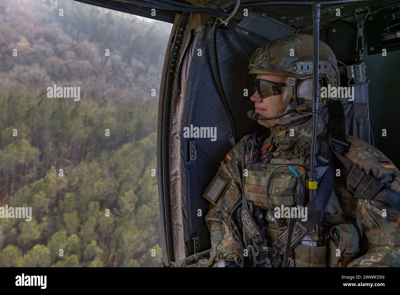 A German soldier with the 6th Battery, 345th Artillery Battalion, rides ...