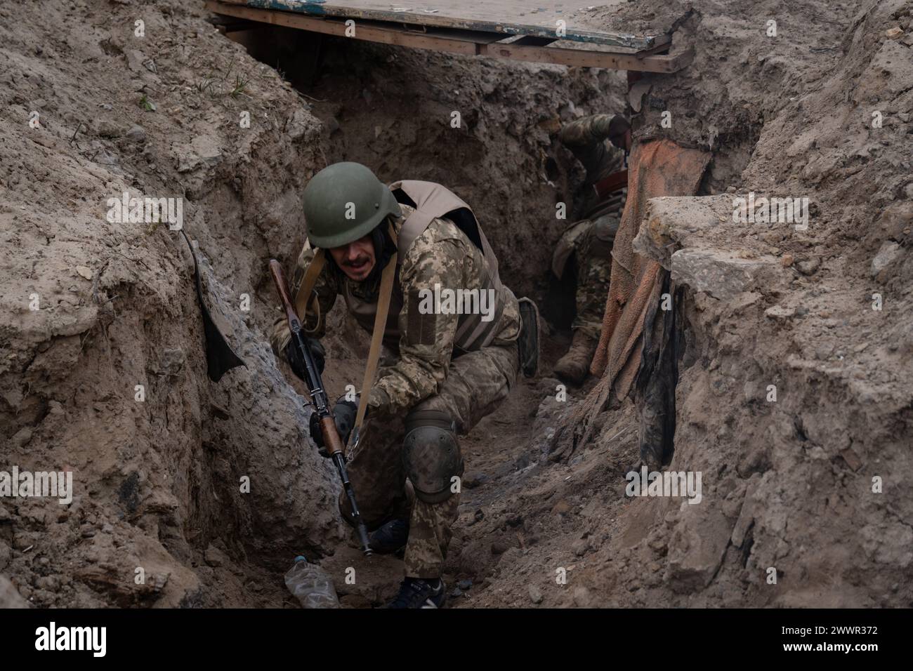 A trainee was seen passing the trenches in a training simulating an ...