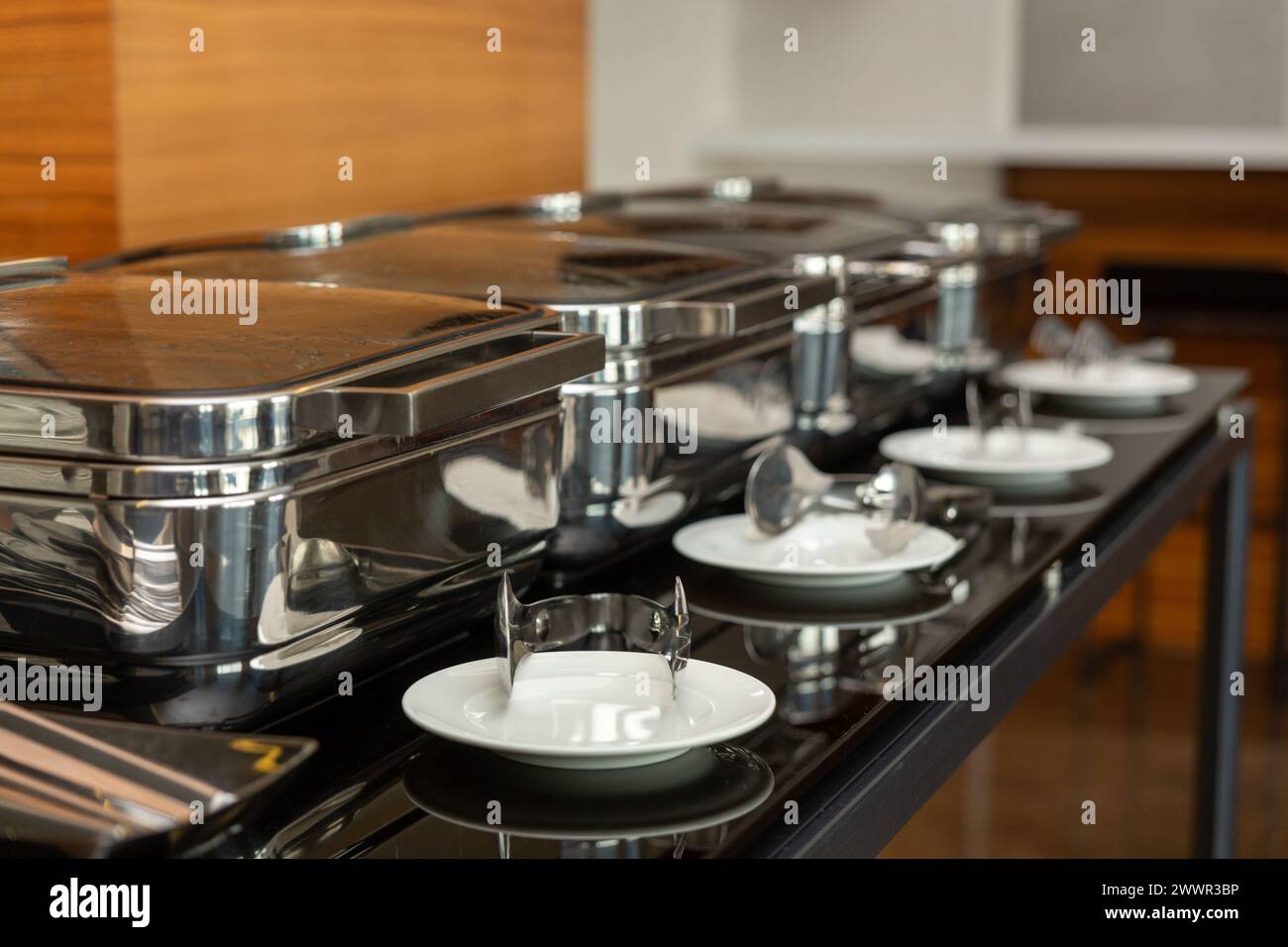 Row of closed buffet food dishes at party banquet hall. Chafing Dish ...