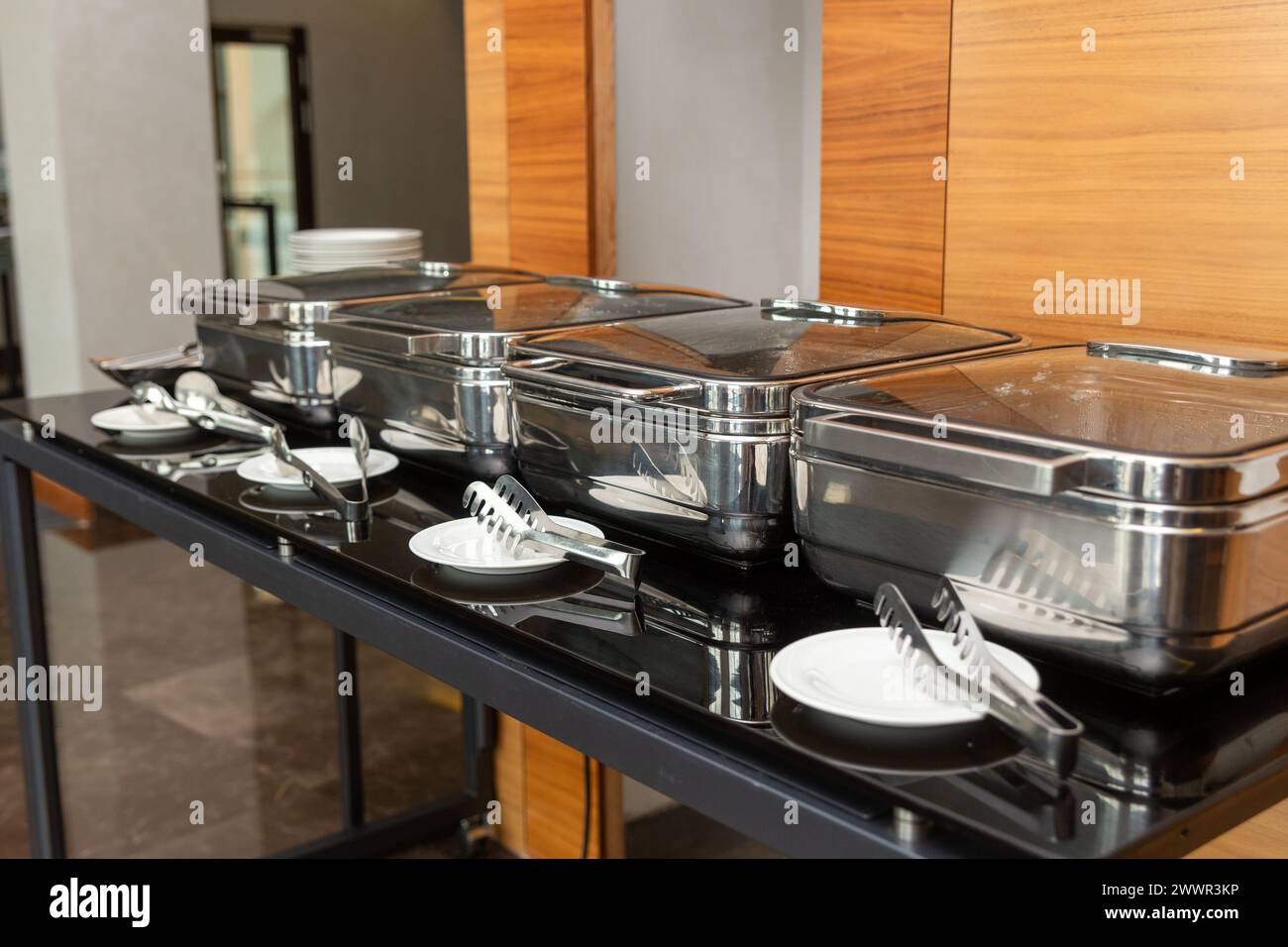 Row of closed buffet food dishes at party banquet hall. Chafing Dish ...