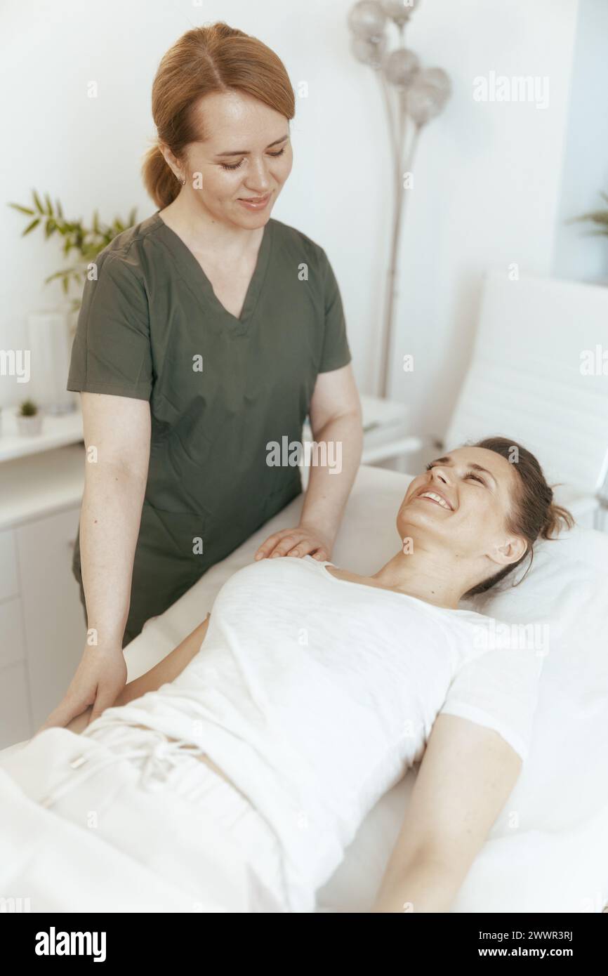 Healthcare Time Smiling Massage Therapist Woman In Massage Cabinet