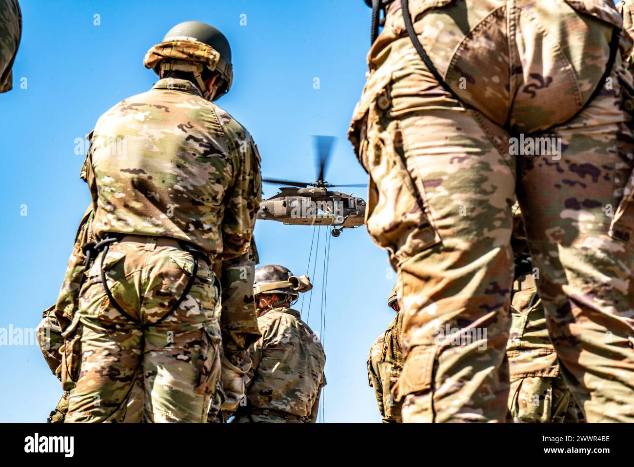 Air Assault candidates rappel out of a UH-60, February 22, 2024. After ...