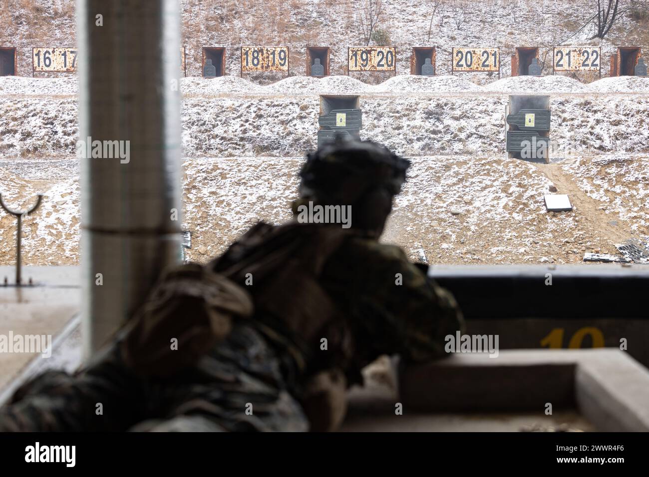 U.S. Marine Corps Lance Cpl. Brian Morris fires an M27 Infantry ...