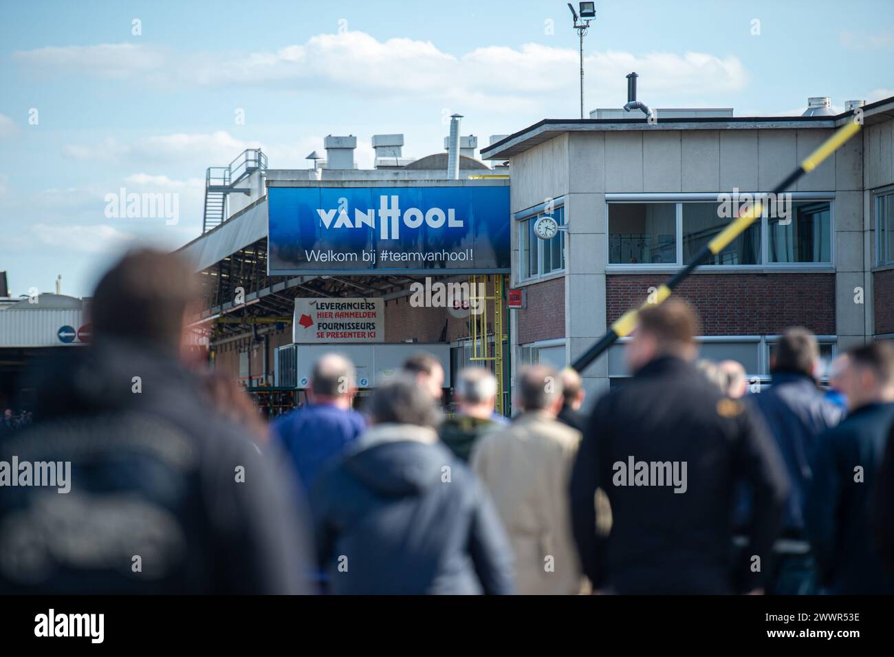 Lier, Belgium. 25th Mar, 2024. Van Hool workers enter an extraordinary ...