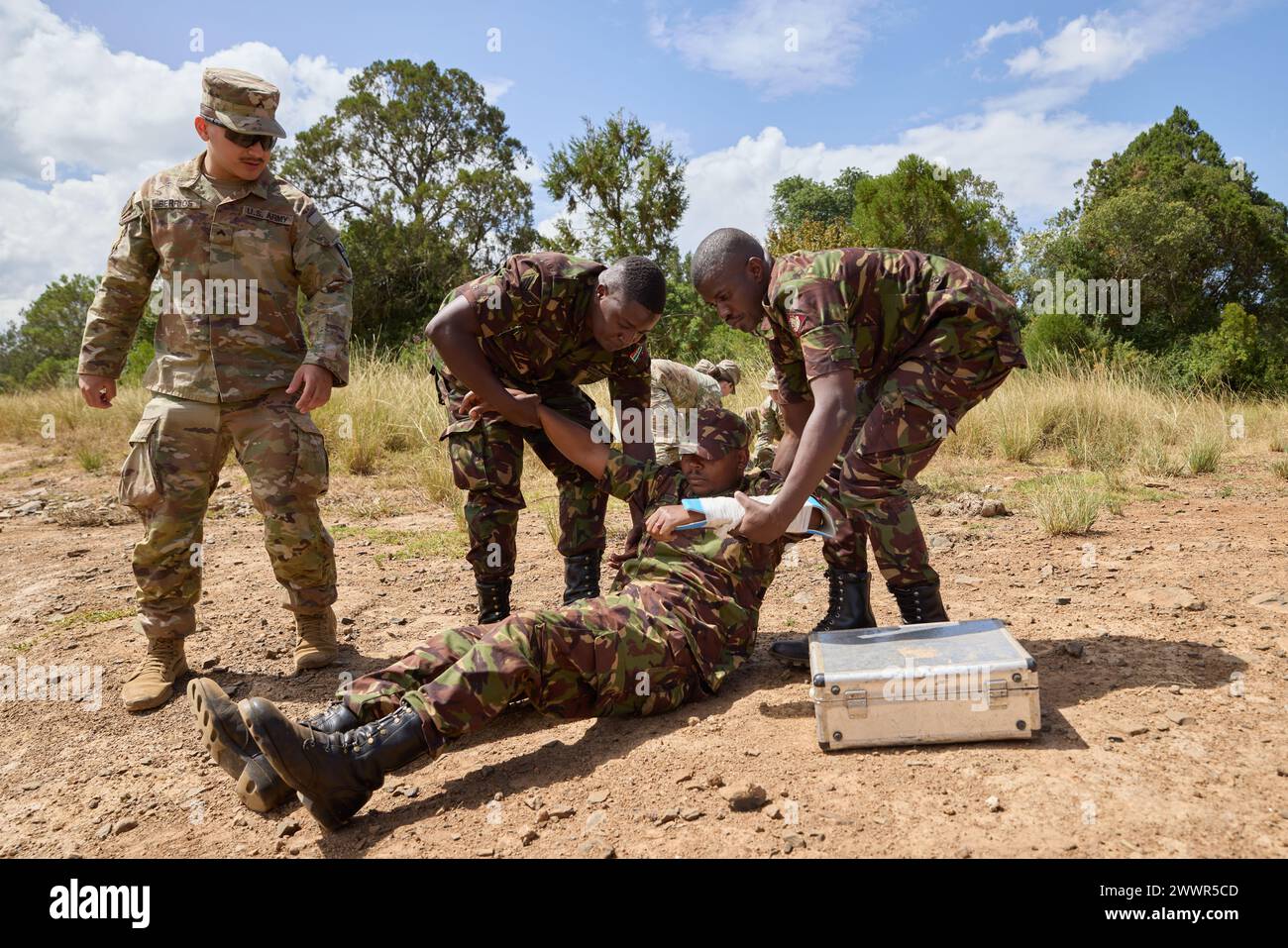Military members from the Kenya Defence Forces, assisted by a U.S. Army ...