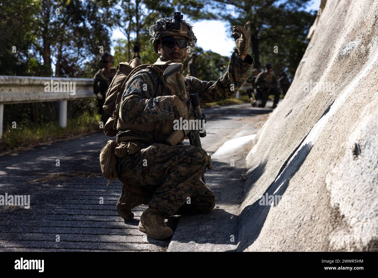U.S. Marines patrol to a notional ambush site at the Jungle Warfare ...