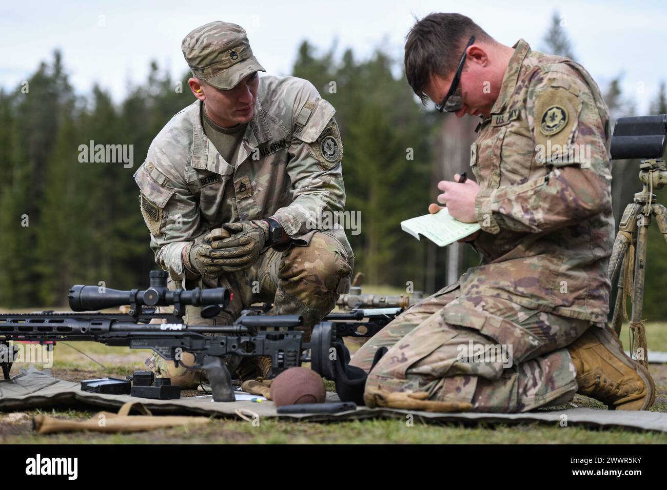 U.S. Army Staff Sgt. Jordon Behr, left, assigned to 4th Squadron, 2nd ...
