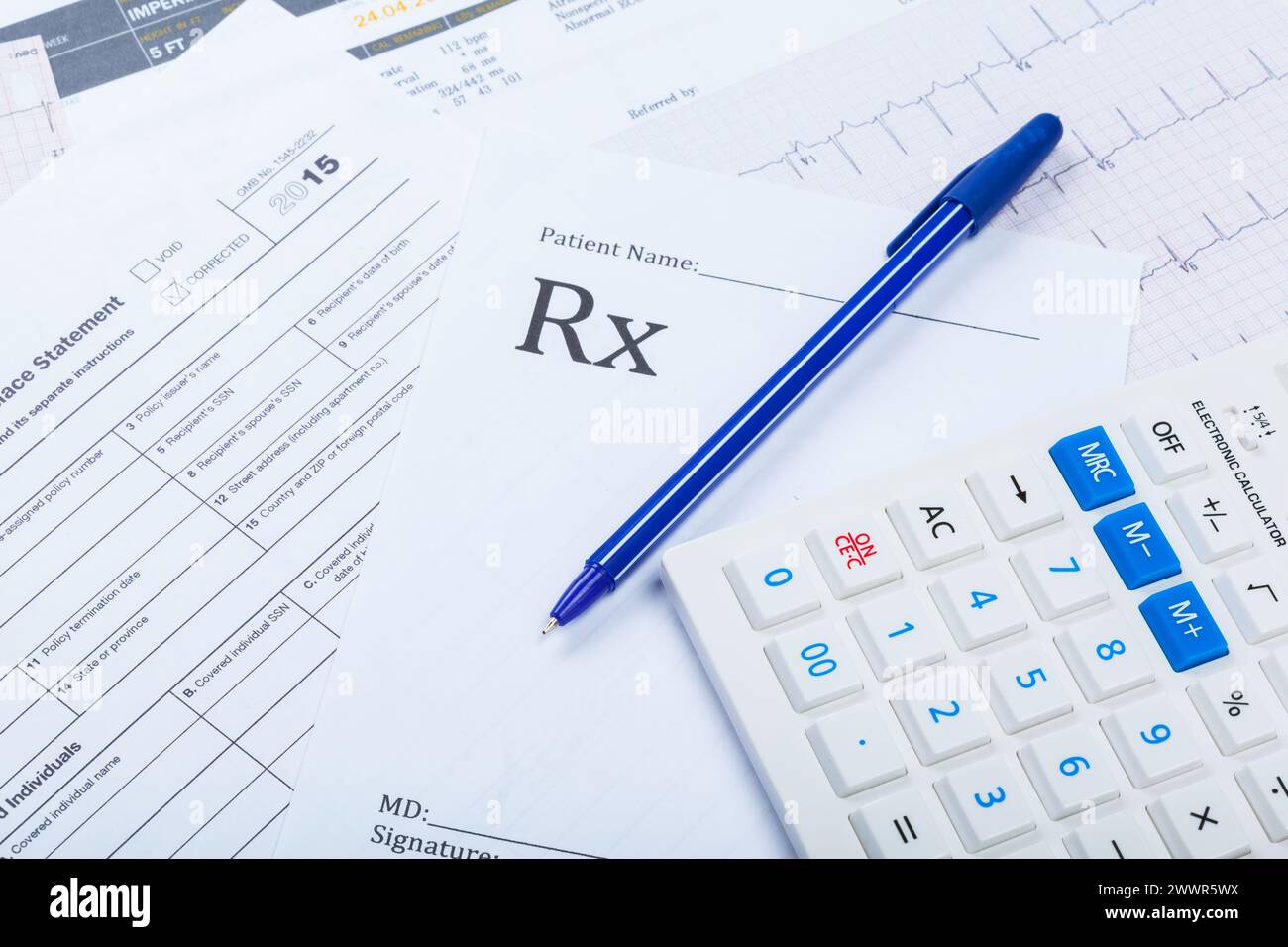 Health care costs. Stethoscope and calculator Stock Photo - Alamy