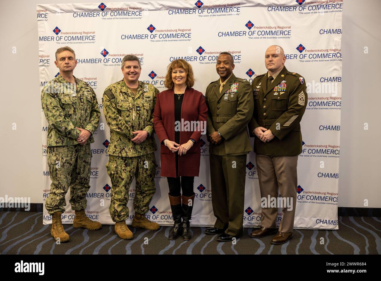 U.S. service members pose for a photo with Susan Spears, the president ...